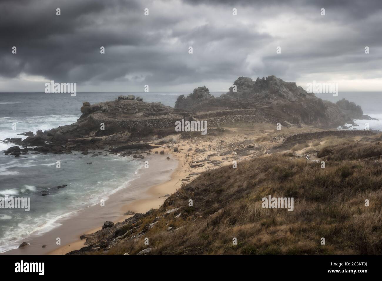 Aerial shot of Castro of Barona ruins in Galicia, Spain under the ...