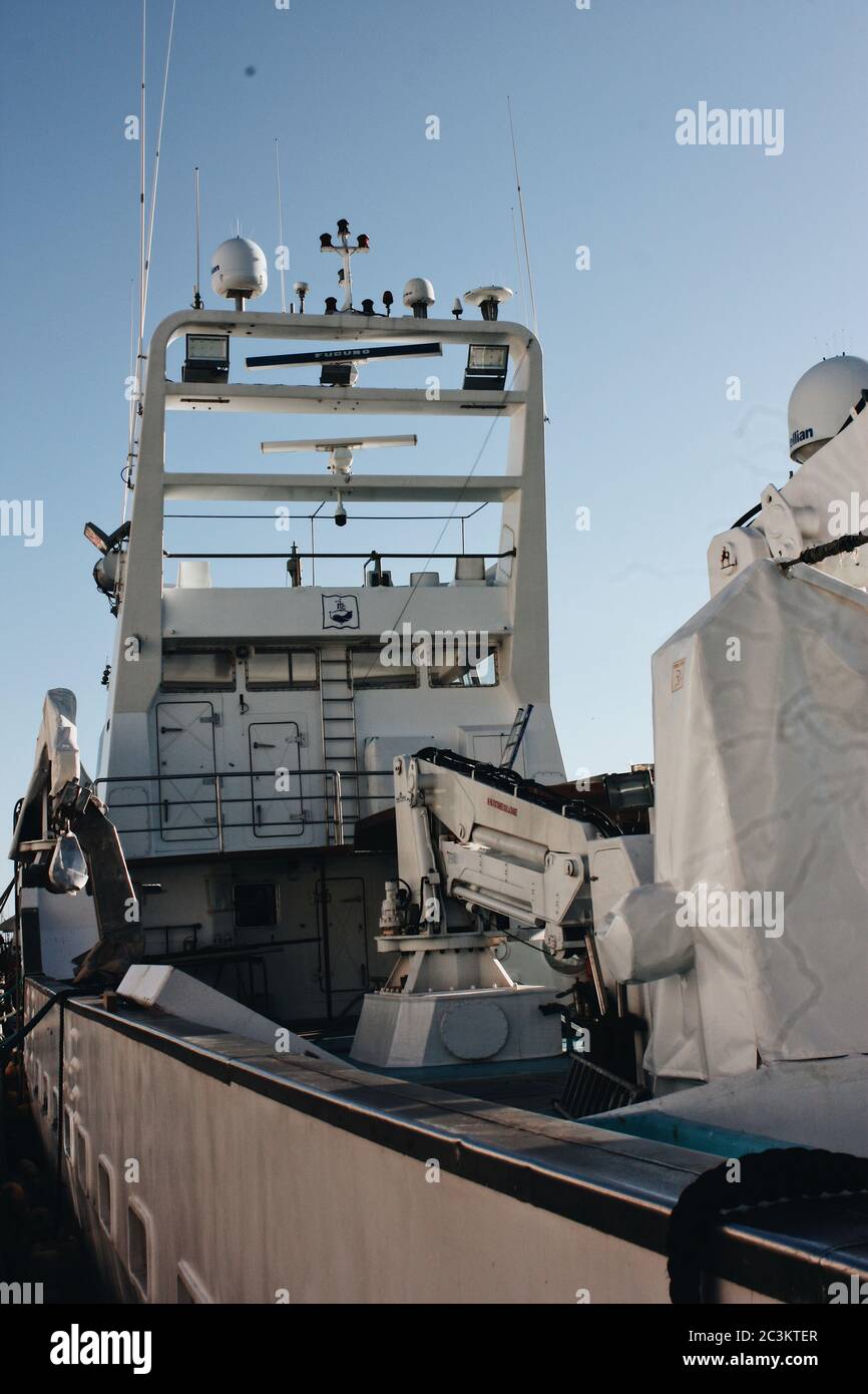 Modern battleship full of technology and satellites against the blue ...