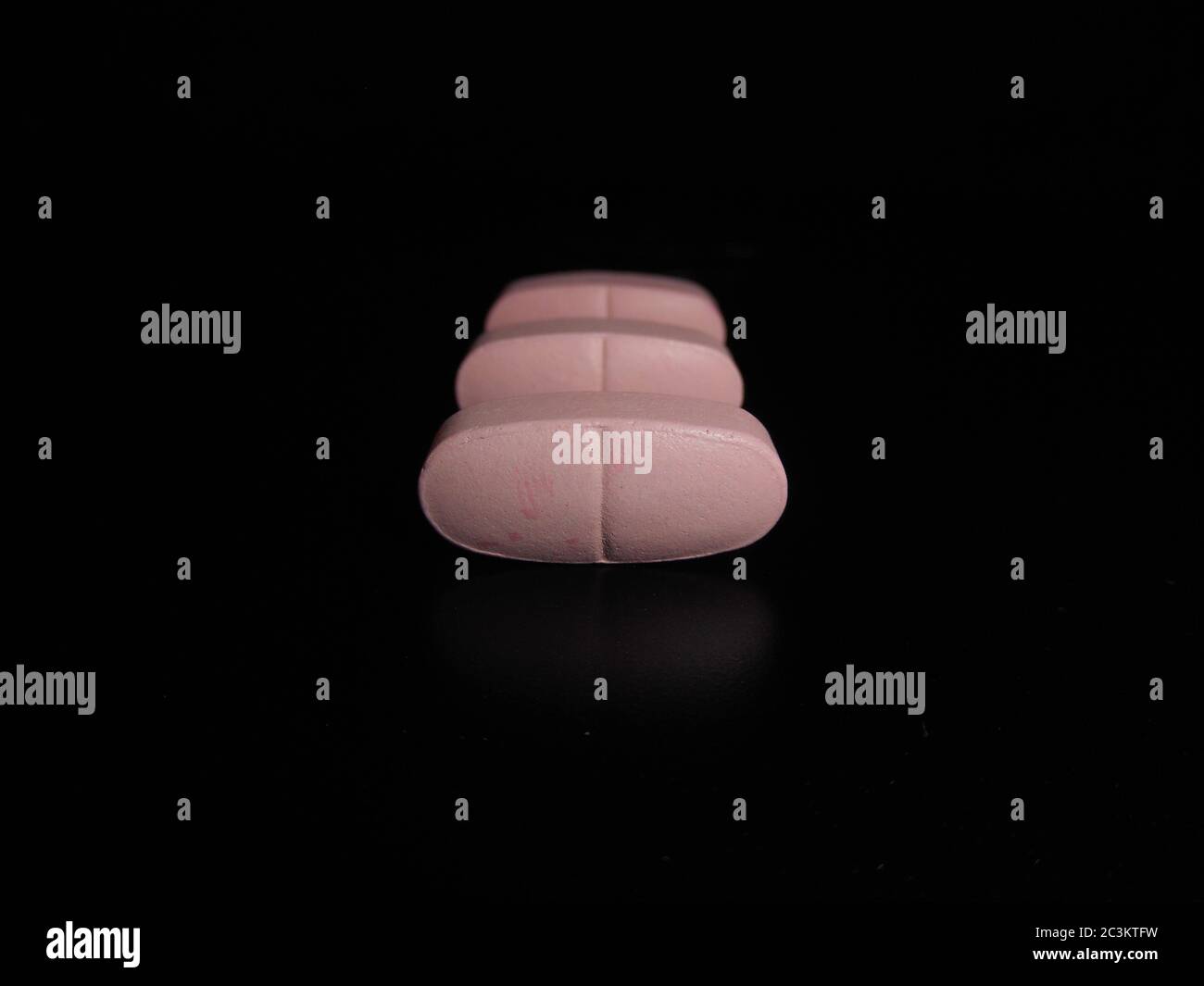covid-19 recovery pills on black background Stock Photo - Alamy