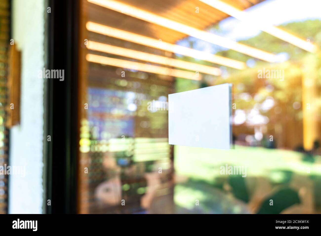 White rectangle are sticked on the glass door in front of seminar hall with blur bokeh ...