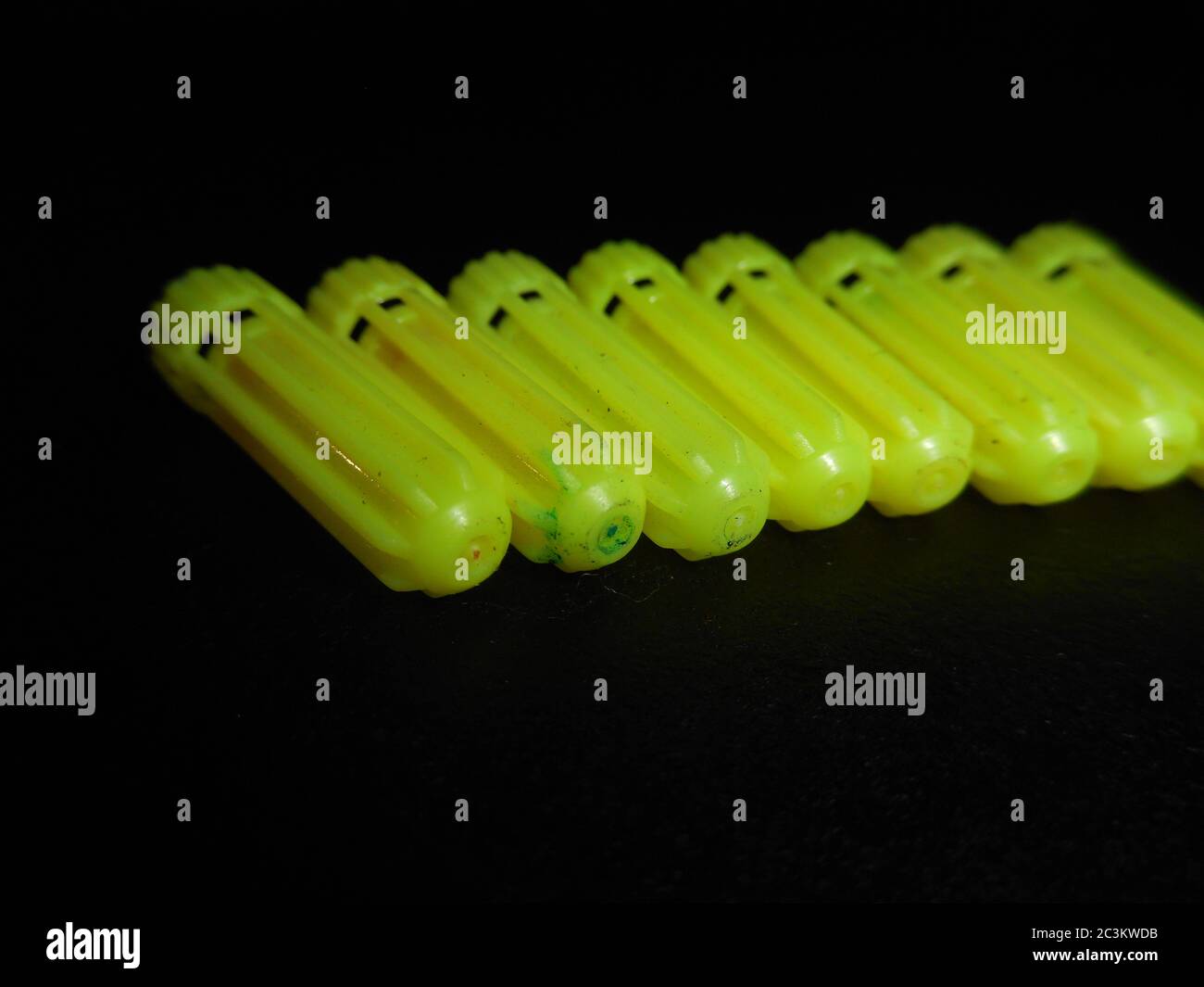 covid-19 vaccine caps on black background Stock Photo - Alamy