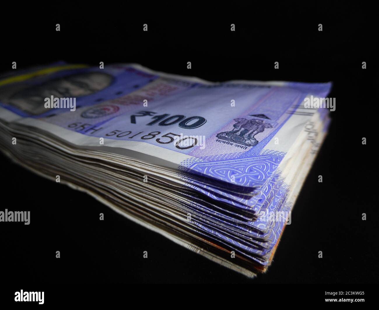 Indian currency,over background as black Stock Photo - Alamy
