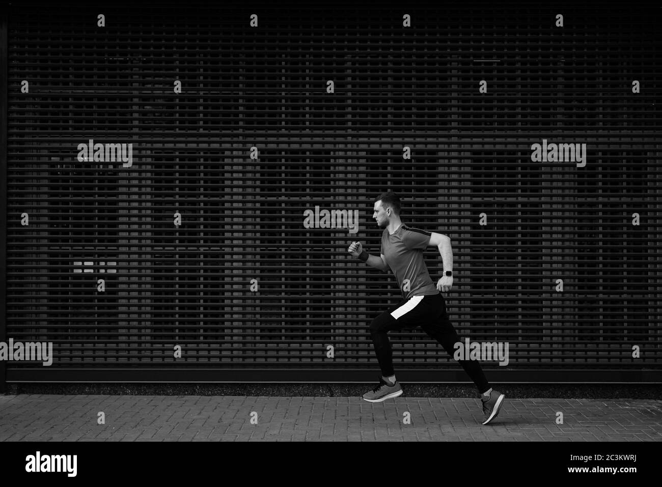 Young sporty black man runner Black and White Stock Photos & Images - Alamy