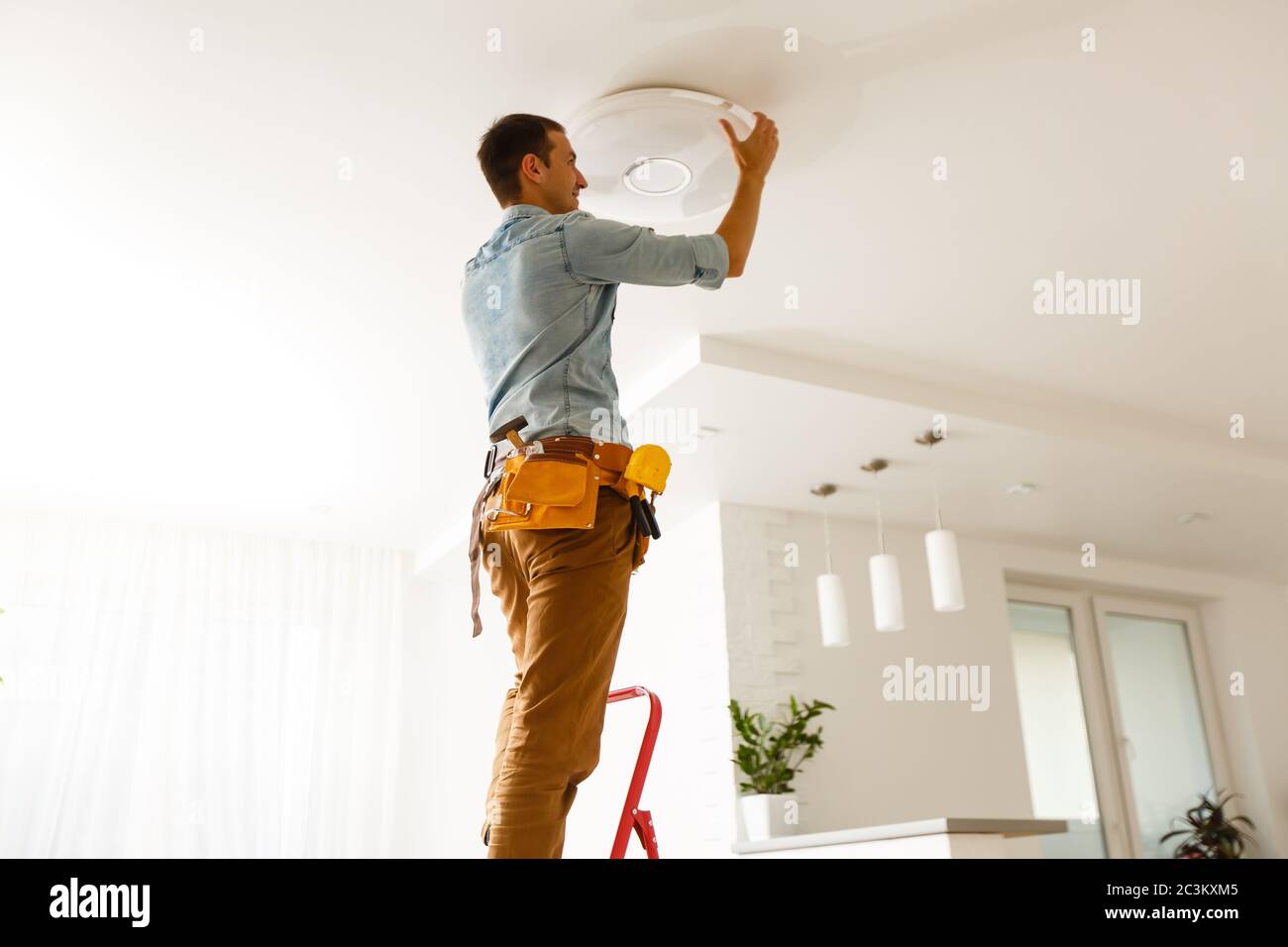 Man checking electric current light hi-res stock photography and images ...
