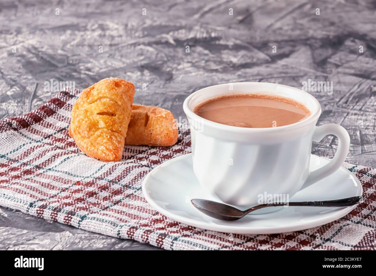 Coffee with cream and freshly baked puffs on a gray background Stock ...