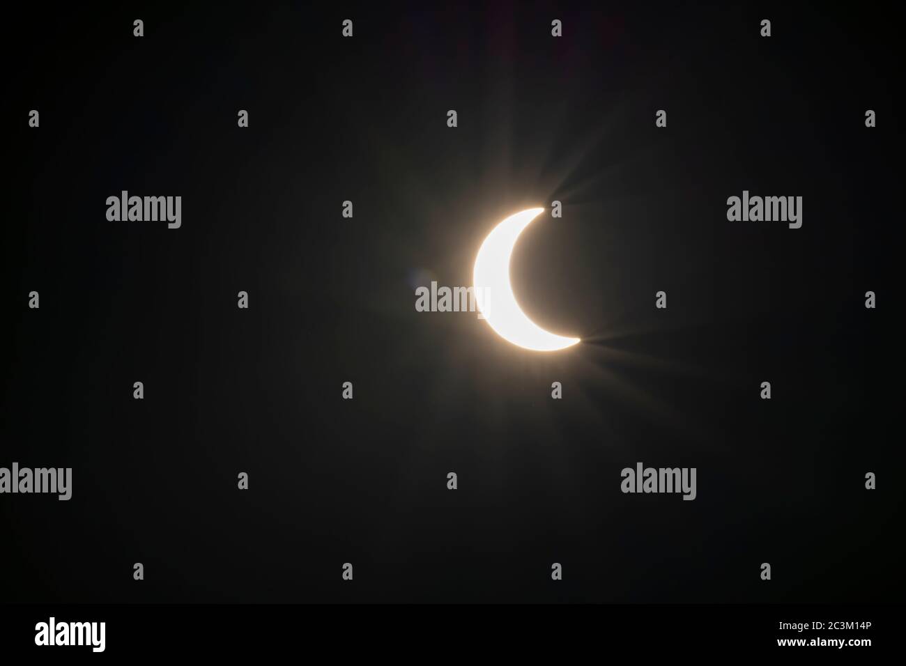 Partial solar eclipse as seen from Doha, Qatar Stock Photo - Alamy