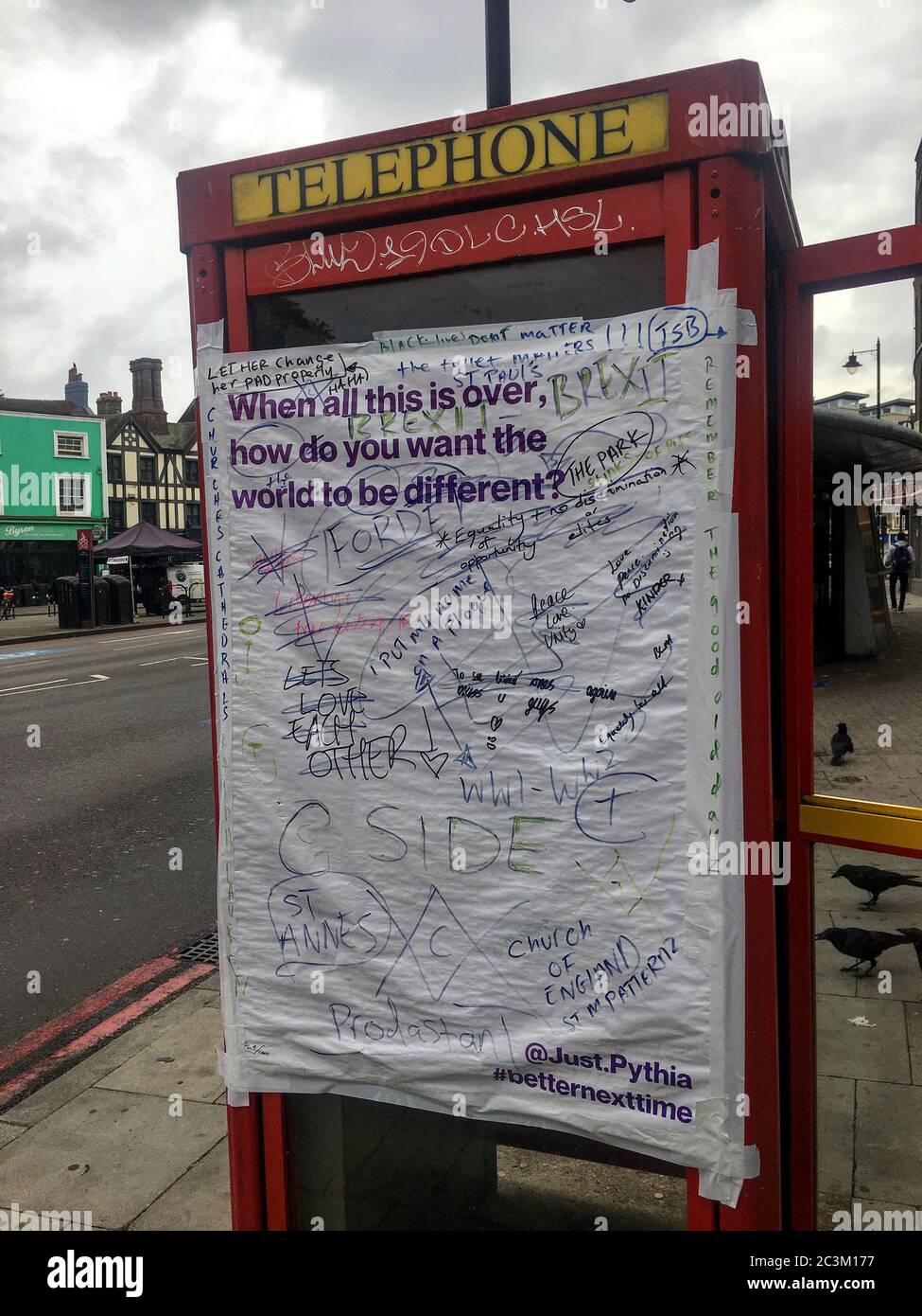 Telephone box with board for messages Stock Photo - Alamy