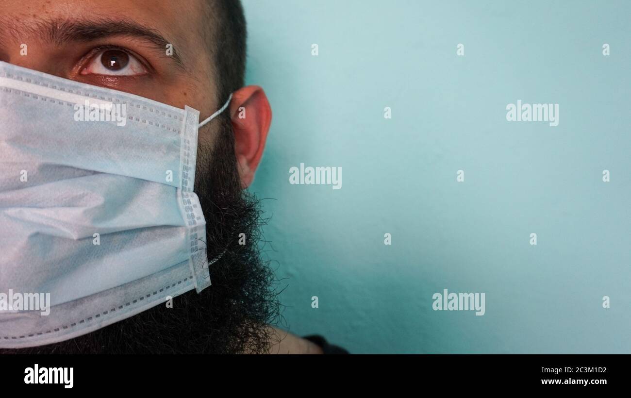 Wearing a facemask with a beard hi-res stock photography and images - Alamy