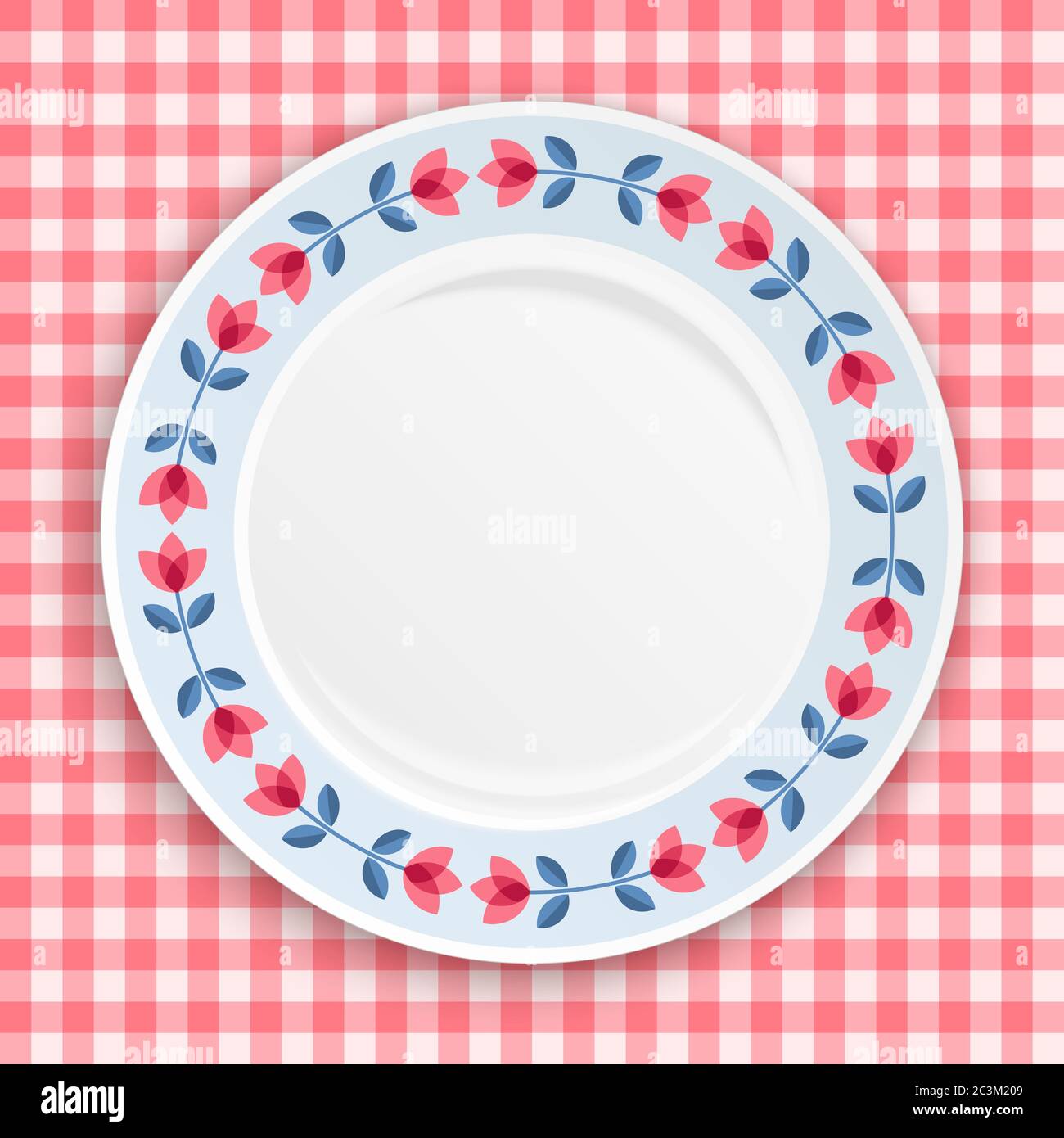 Decorative plate with patterned floral border, on gingham tablecloth ...