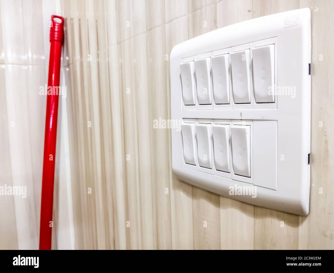 White Light switch on switchboard - Light brown background Stock Photo ...