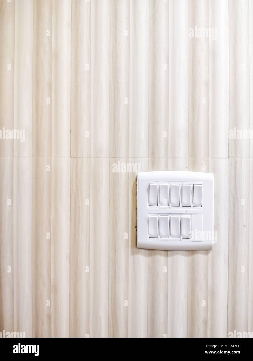 White Light switch on switchboard - Light brown background Stock Photo ...