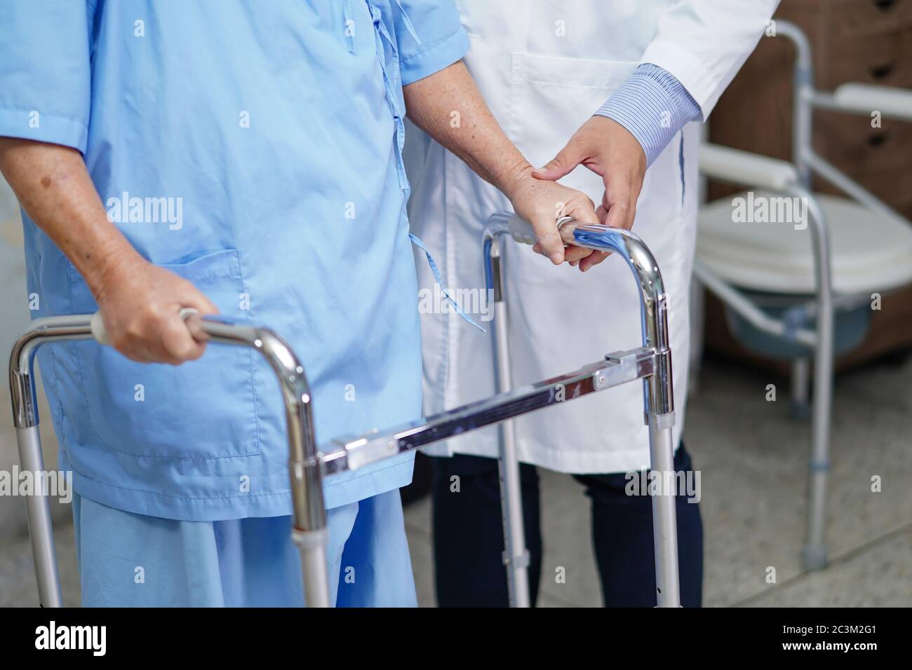 Doctor help Asian senior or elderly old lady woman patient walk with ...