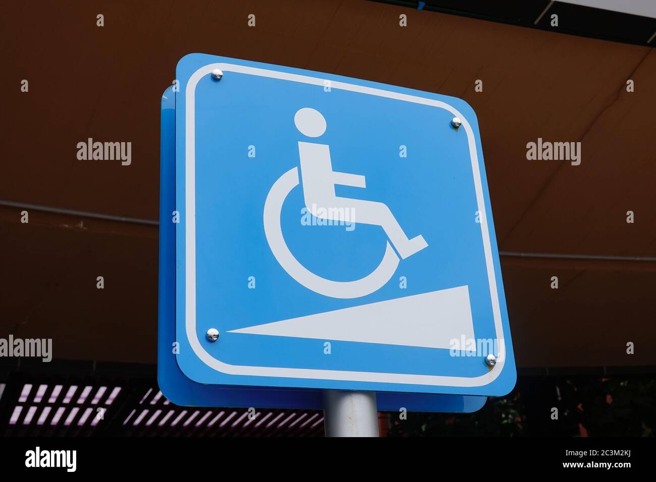 Blue Handicap at parking car sign outdoors for Disabled, Wheelchair or ...