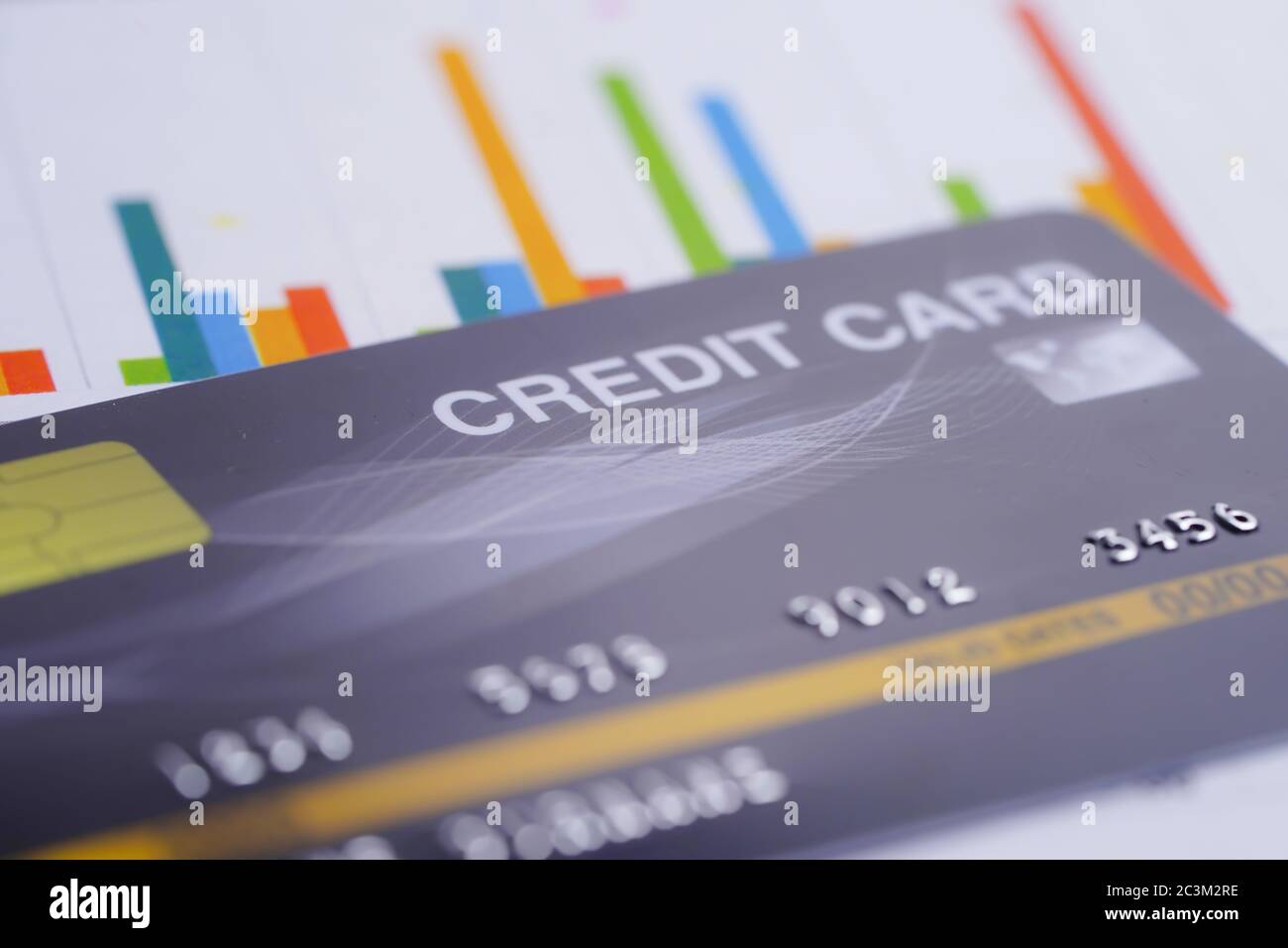 Credit card model on chart and graph spreadsheet paper. Finance ...