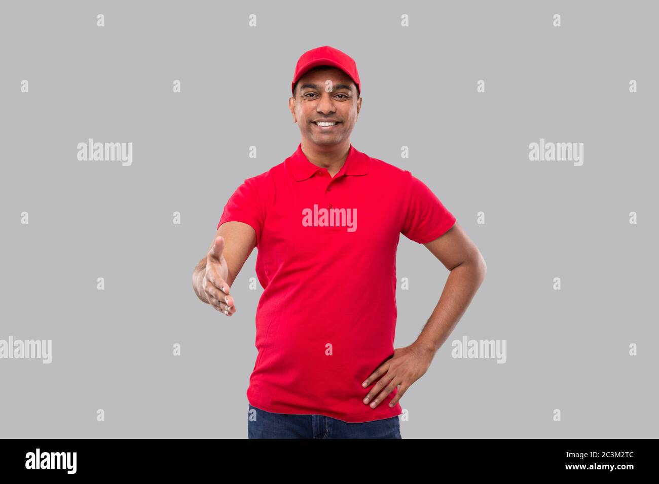 Indian Delivery Man offering hand to shake. Greeting and welcoming ...