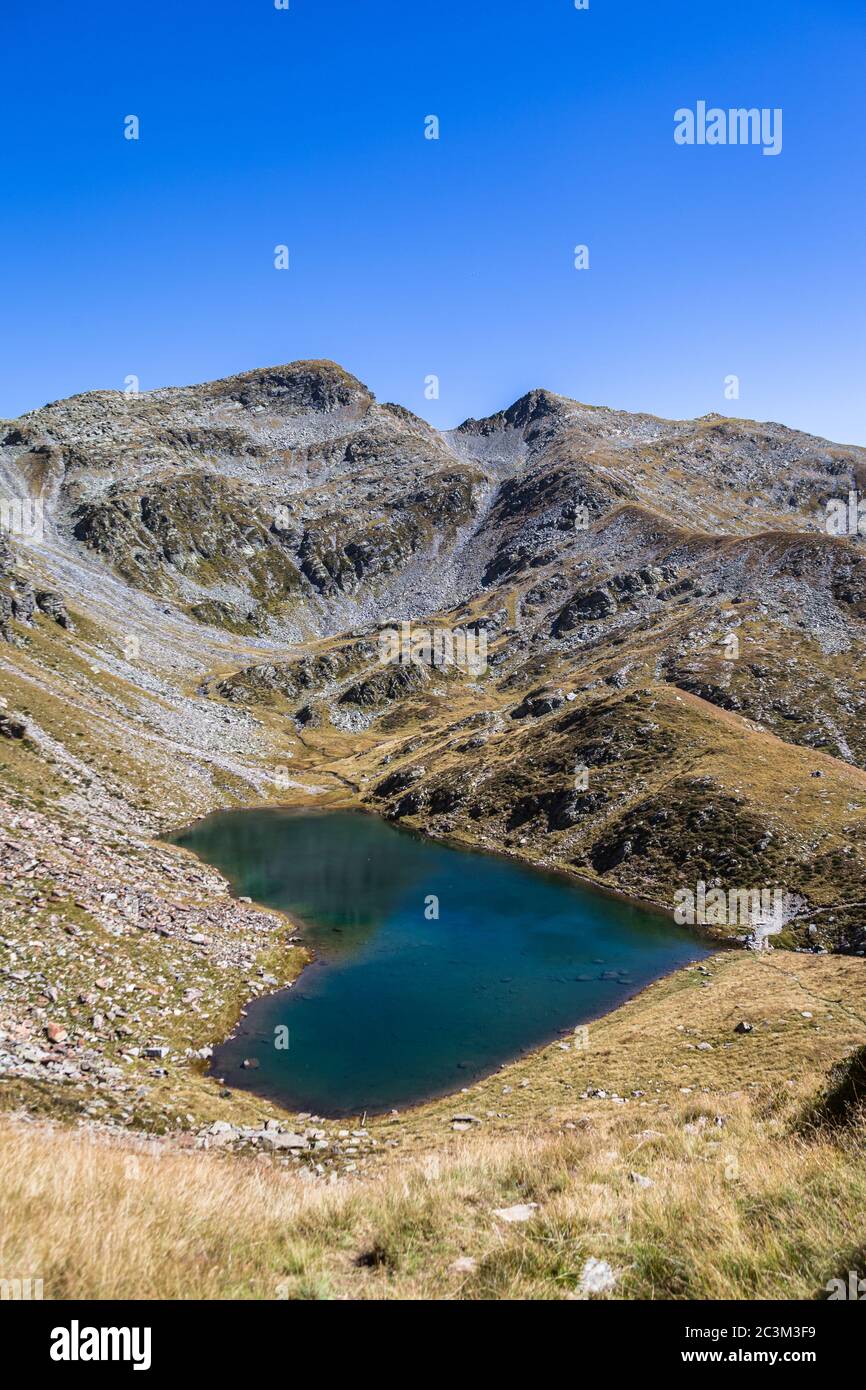 Stunning ariel view of the Lagh de Calvaresc lake with heart shape, in ...