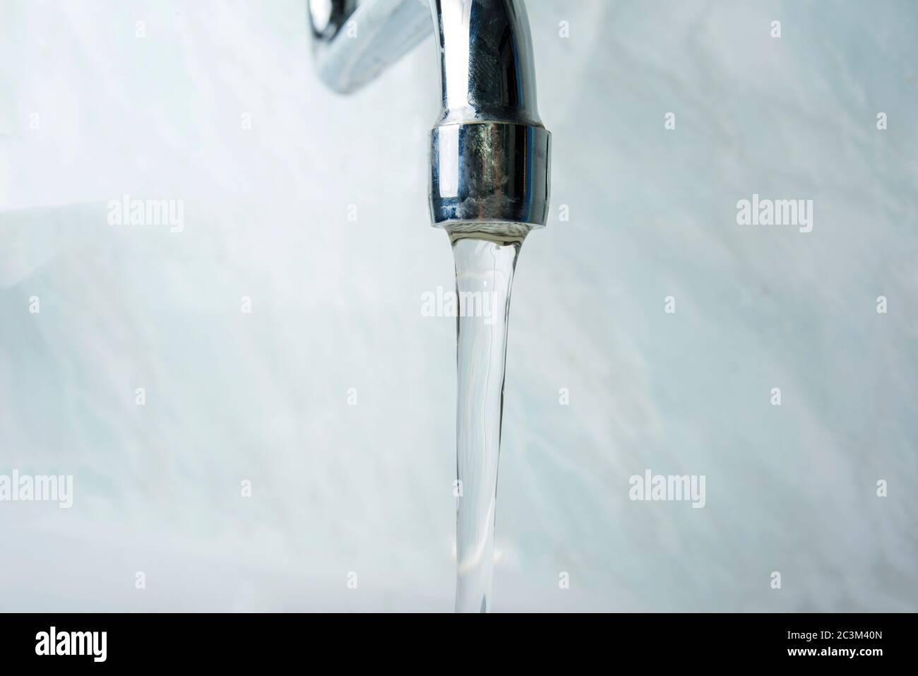 Running water faucet in the bathroom Stock Photo - Alamy