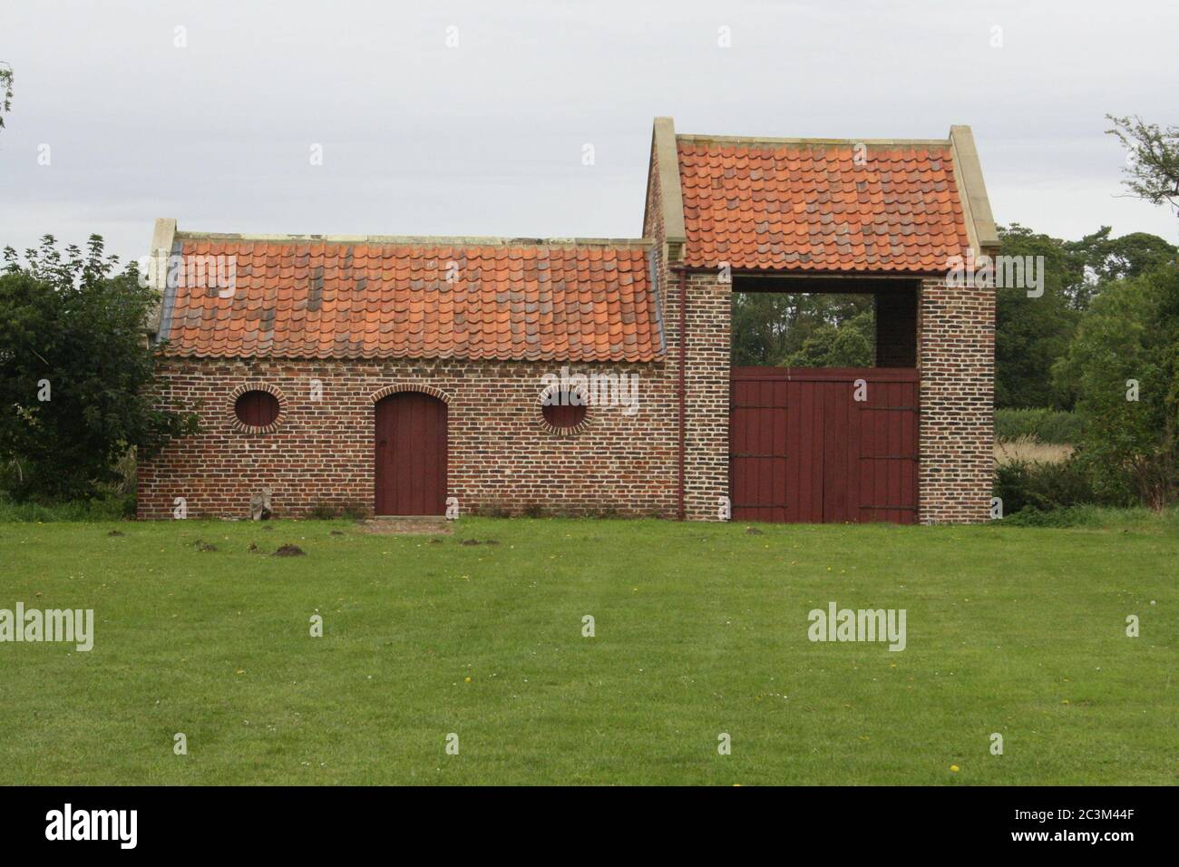 Old farm building in a field Stock Photo - Alamy