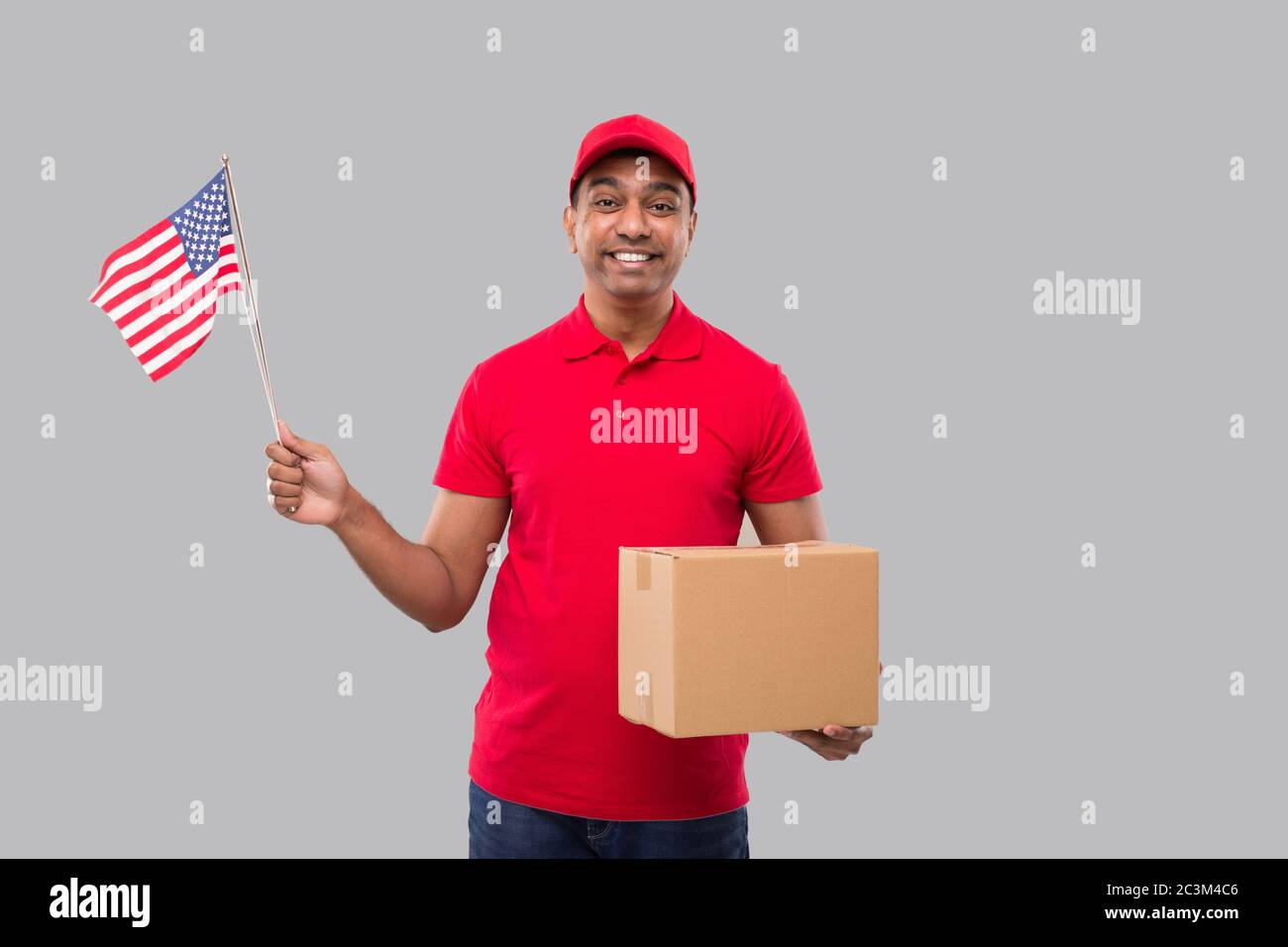 Delivery Man Box and USA Flag in Hands Isolated. Red Tshirt Indian ...