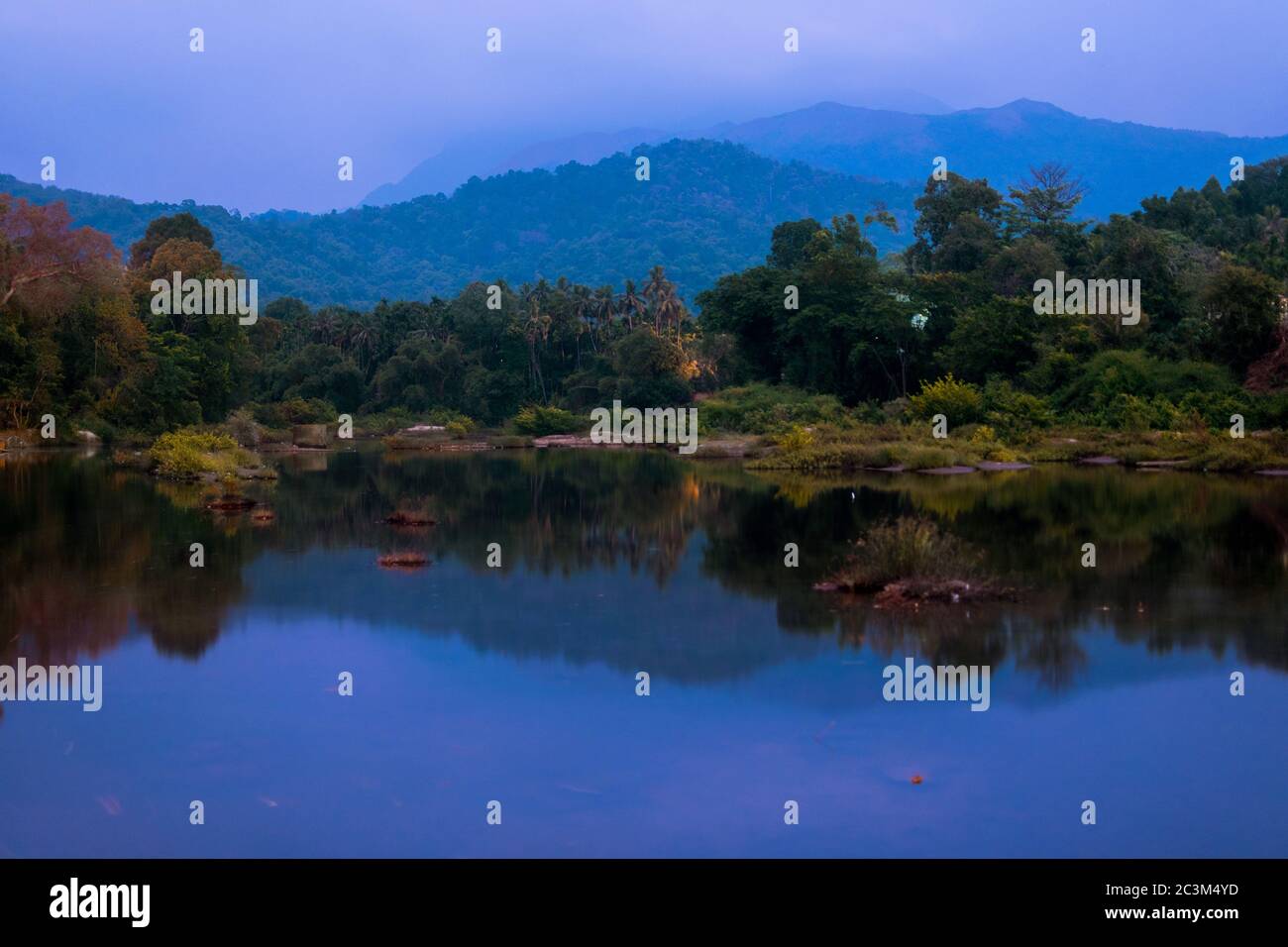 Amazing shot of a reflective lake surface on a beautiful landscape ...