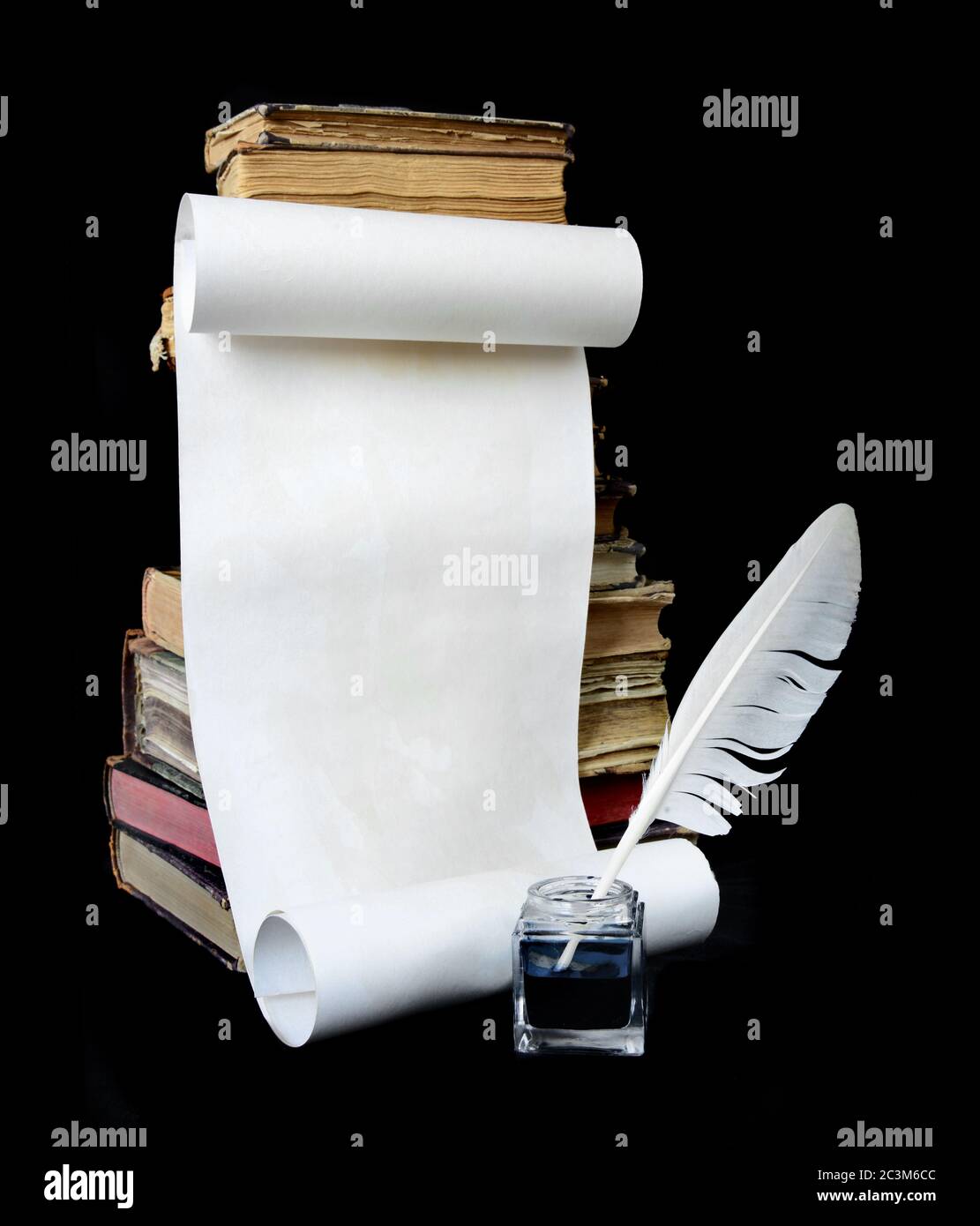 Still life with paper scroll, pen and stack of old books are isolated ...