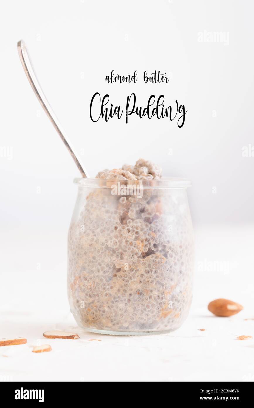Vertical shot of a chia pudding with almond butter isolated on white ...