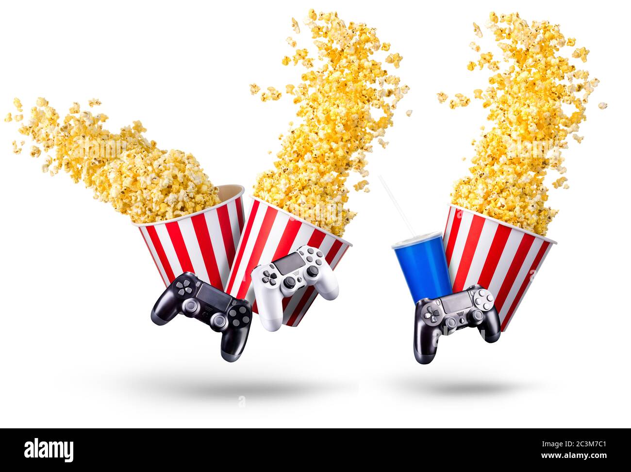 Paper bucket with popcorn, cup of drink and video game joystick on ...