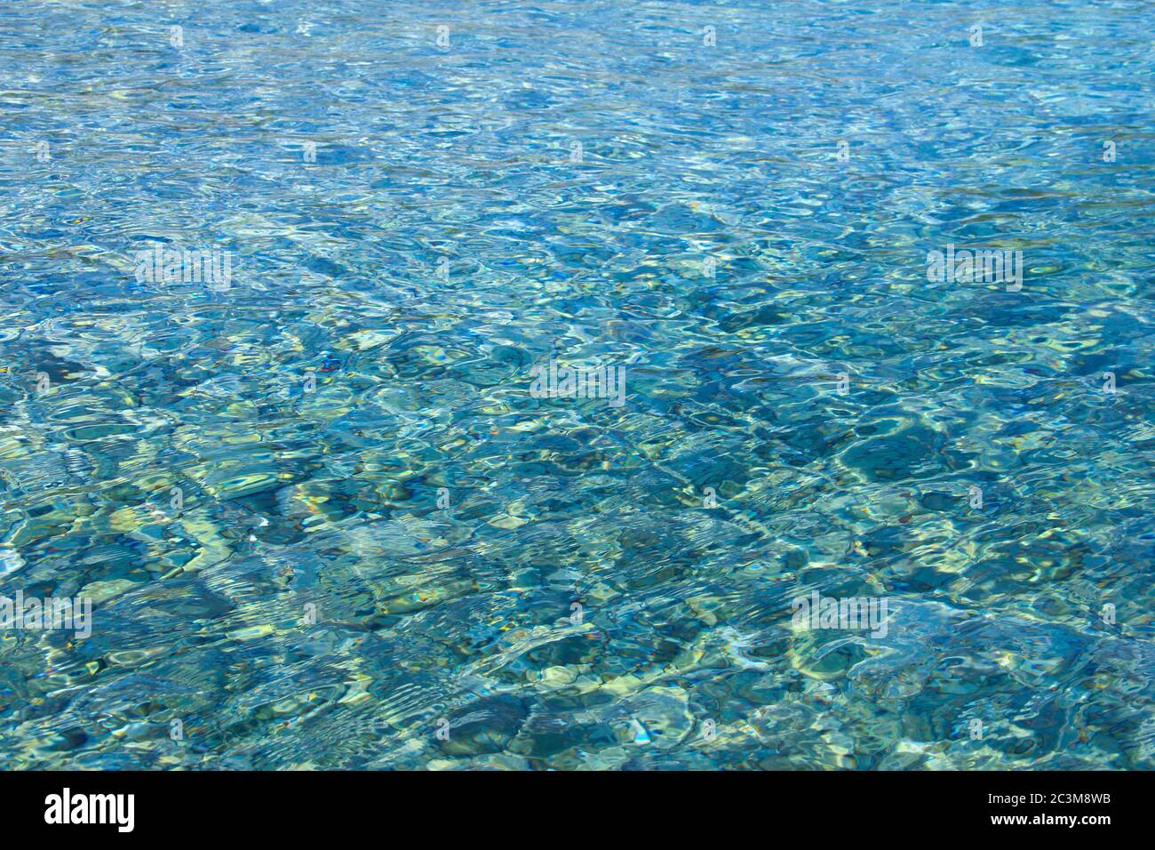 Beautiful background of crystal clear transparent sea water at sunny ...