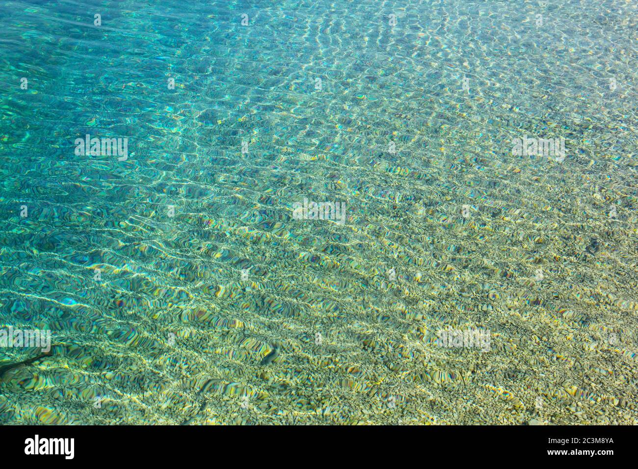Beautiful background of crystal clear transparent sea water at sunny ...