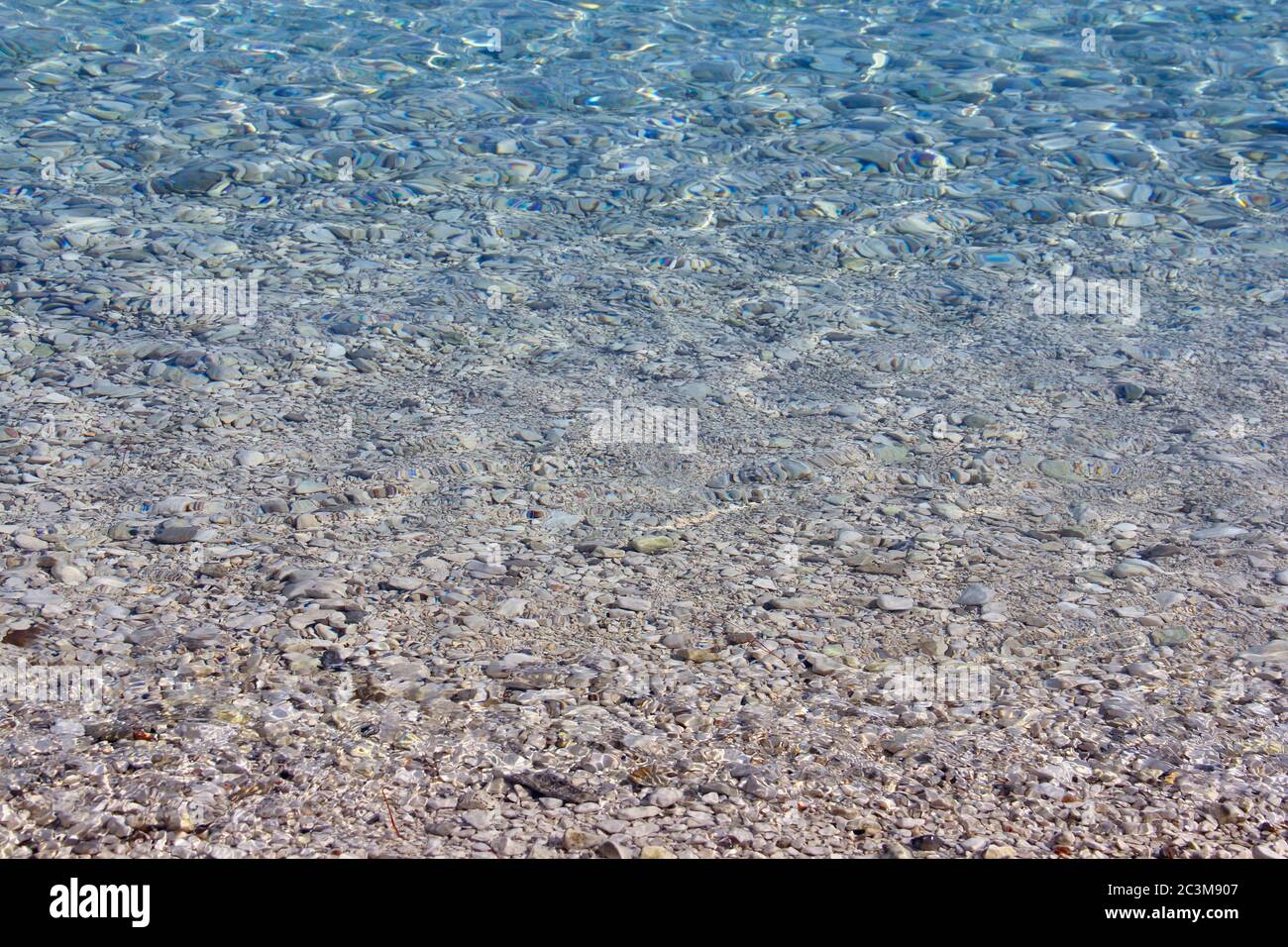 Beautiful background of crystal clear transparent sea water at sunny ...