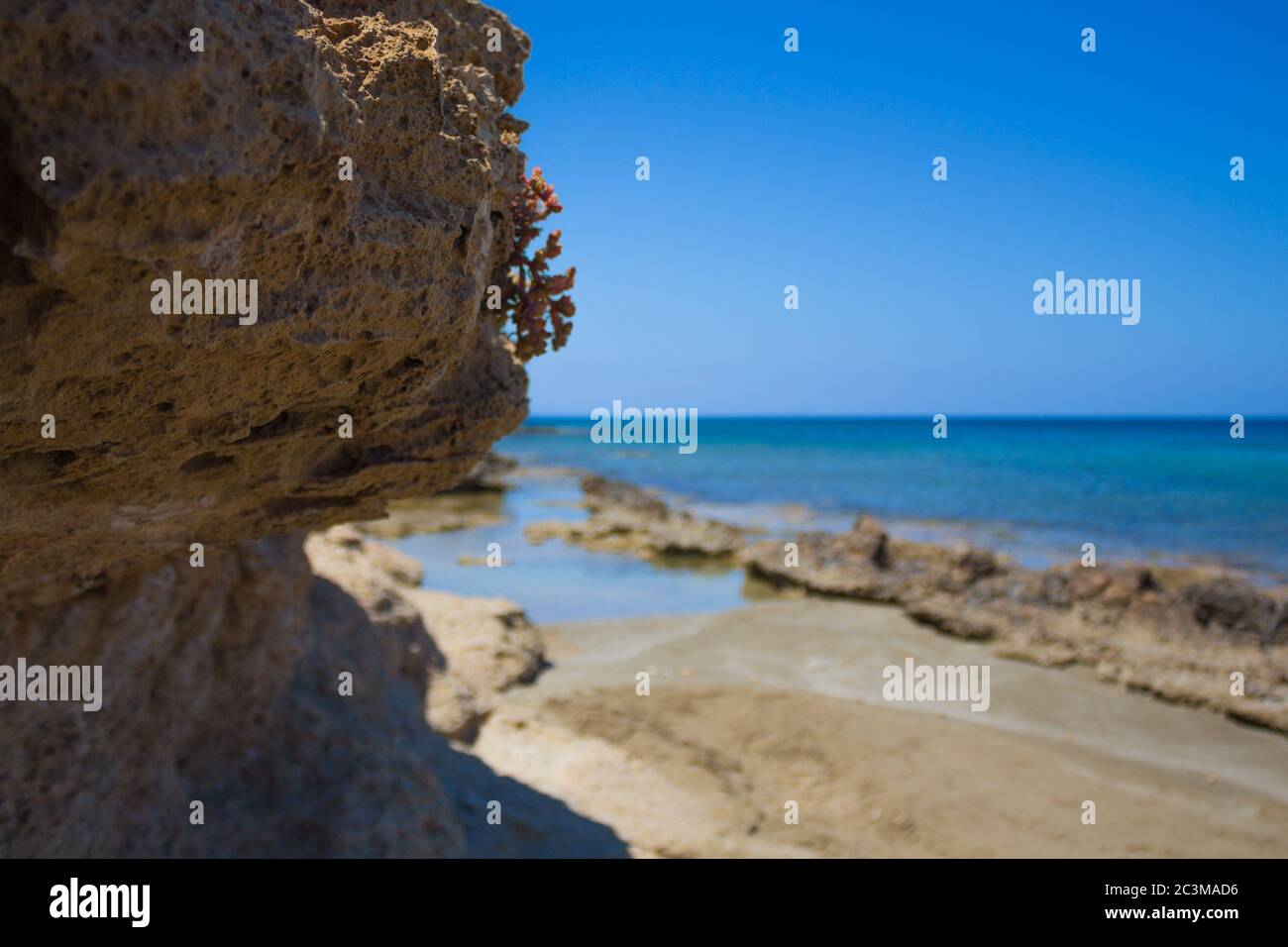 Rocks on the Mediterranean beach Stock Photo - Alamy