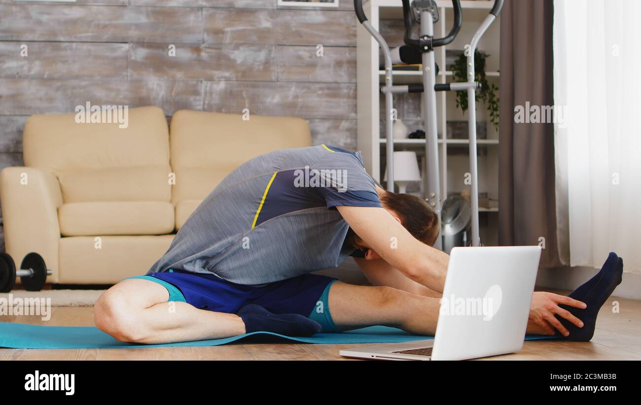 Guy stretching ball hi-res stock photography and images - Alamy