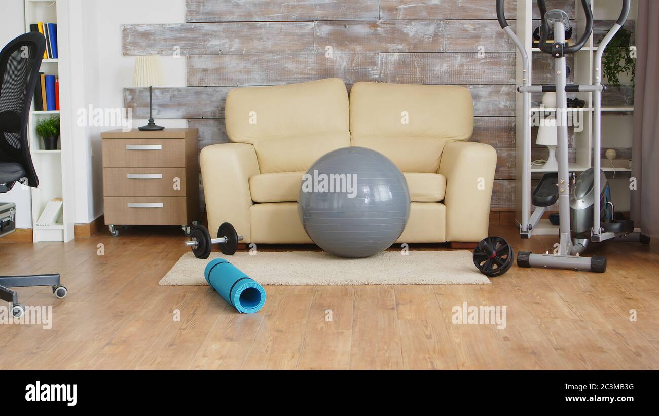 Elliptical e fit and fitness ball in room with nobody in it Stock Photo ...
