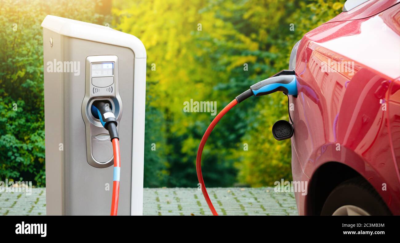 Charging station on the background of an electric car Stock Photo - Alamy