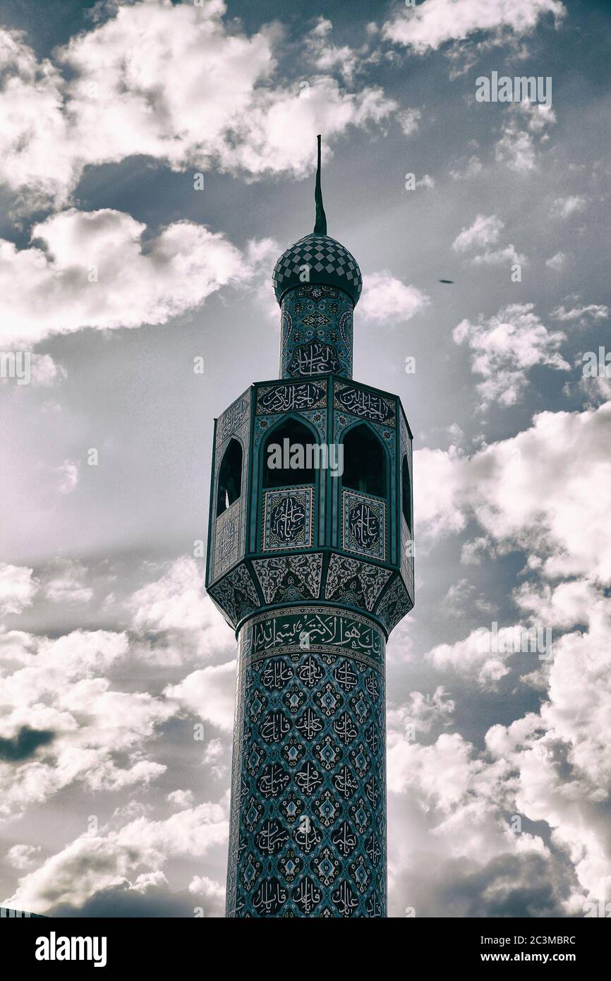 Vertical shot of a beautiful green tower of a Mosque at daytime Stock ...