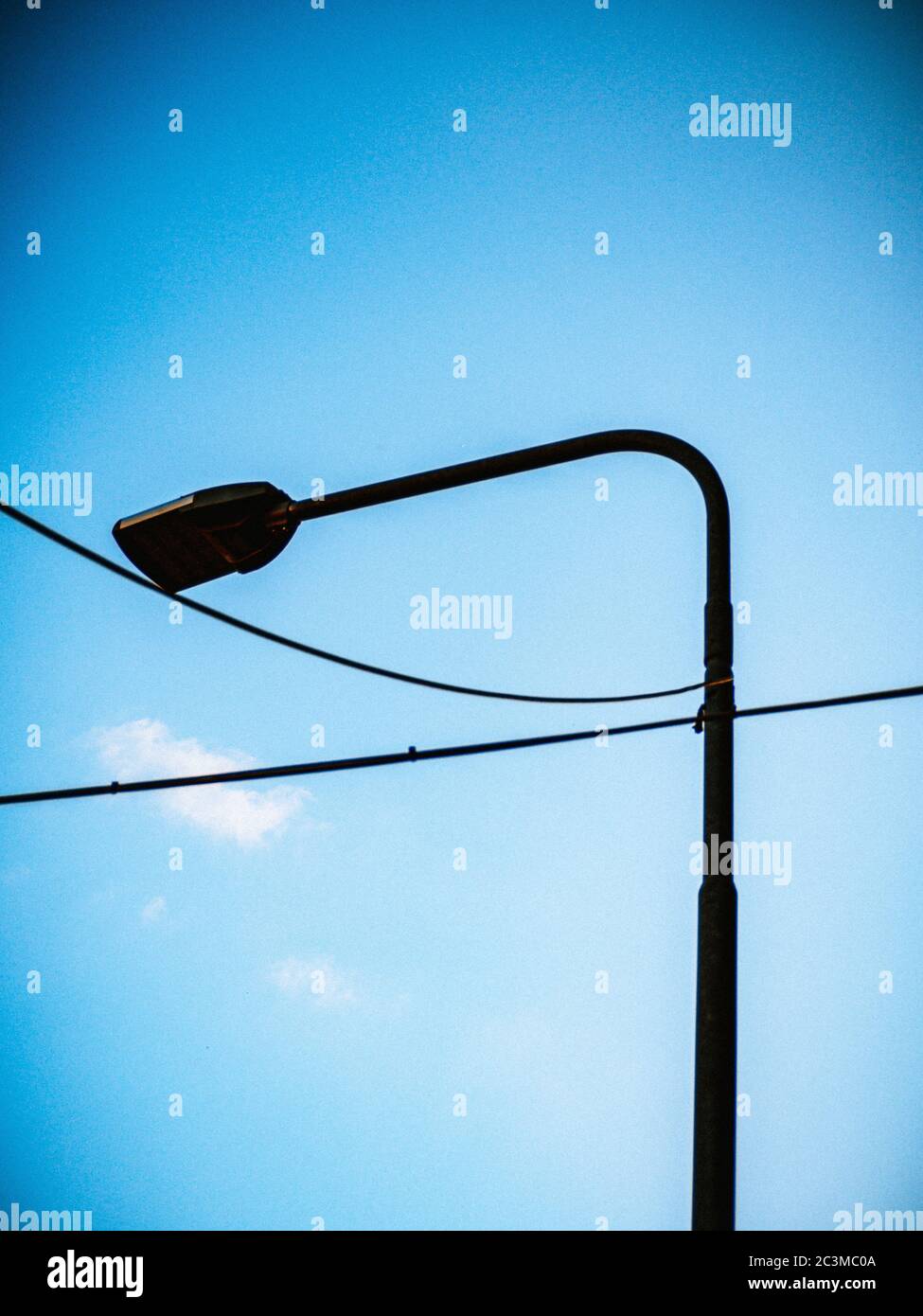 Vertical low angle shot of a tall metal street light at daytime Stock ...