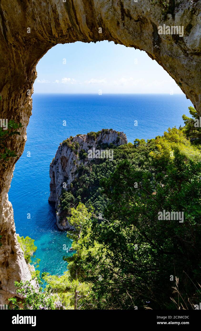 Italy, Campania, Capri - 14 August 2019 - View through the natural arch ...