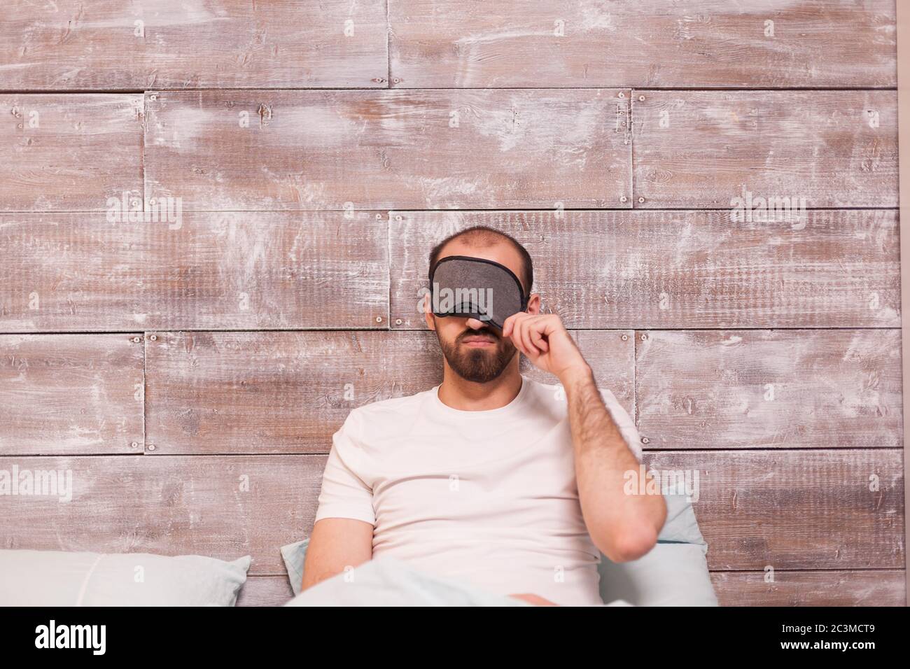 Man wearing sleep mask hi-res stock photography and images - Alamy