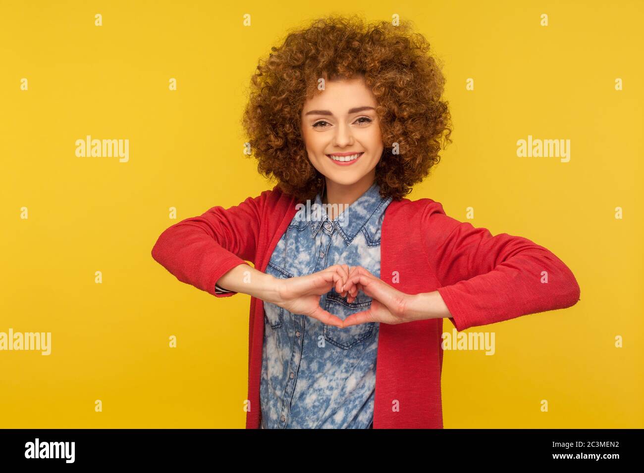 Love you! Portrait of romantic beautiful woman with curly hair showing ...