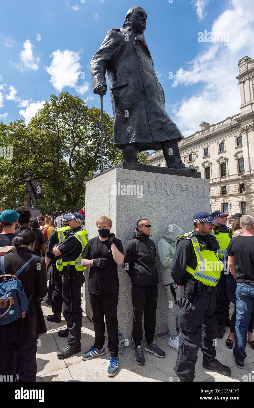 21 June 2020. London, UK. Right-wing supporters guard the statue of Sir ...