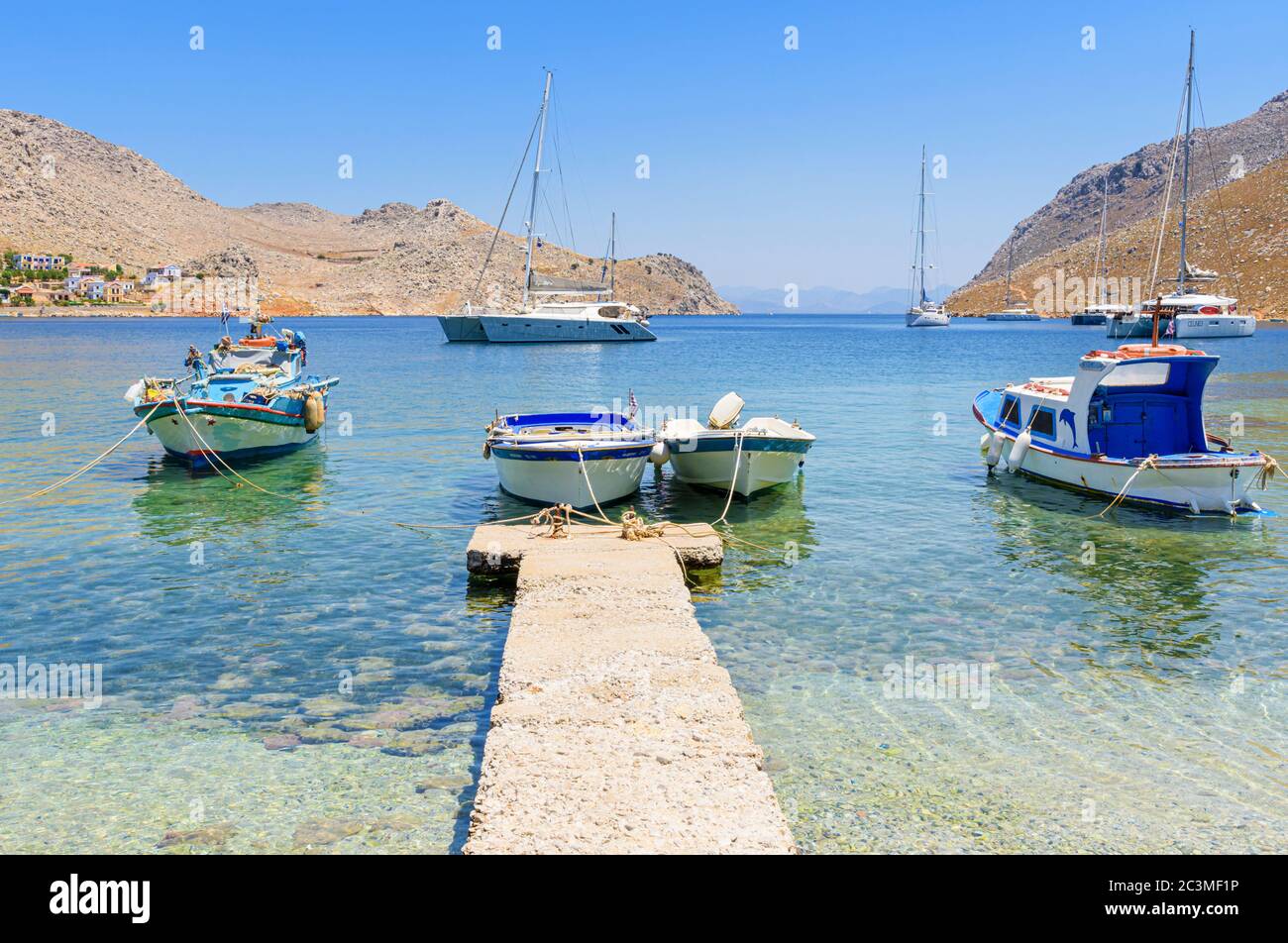 Picturesque seaside town of Pedi on Symi Island, Dodecanese, Greece ...