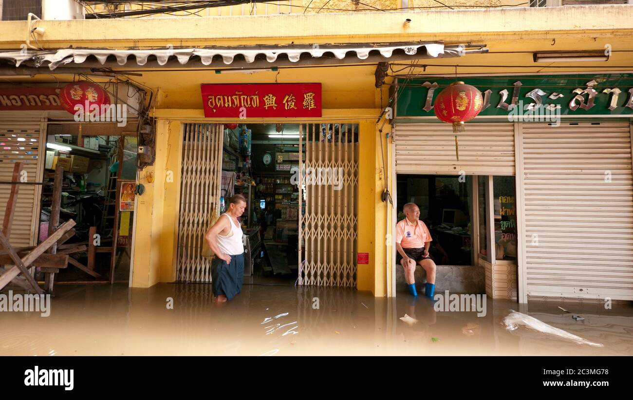 AYUTTAYA, THAILAND - OCTOBER 5: Flooded shops and shop owners during ...