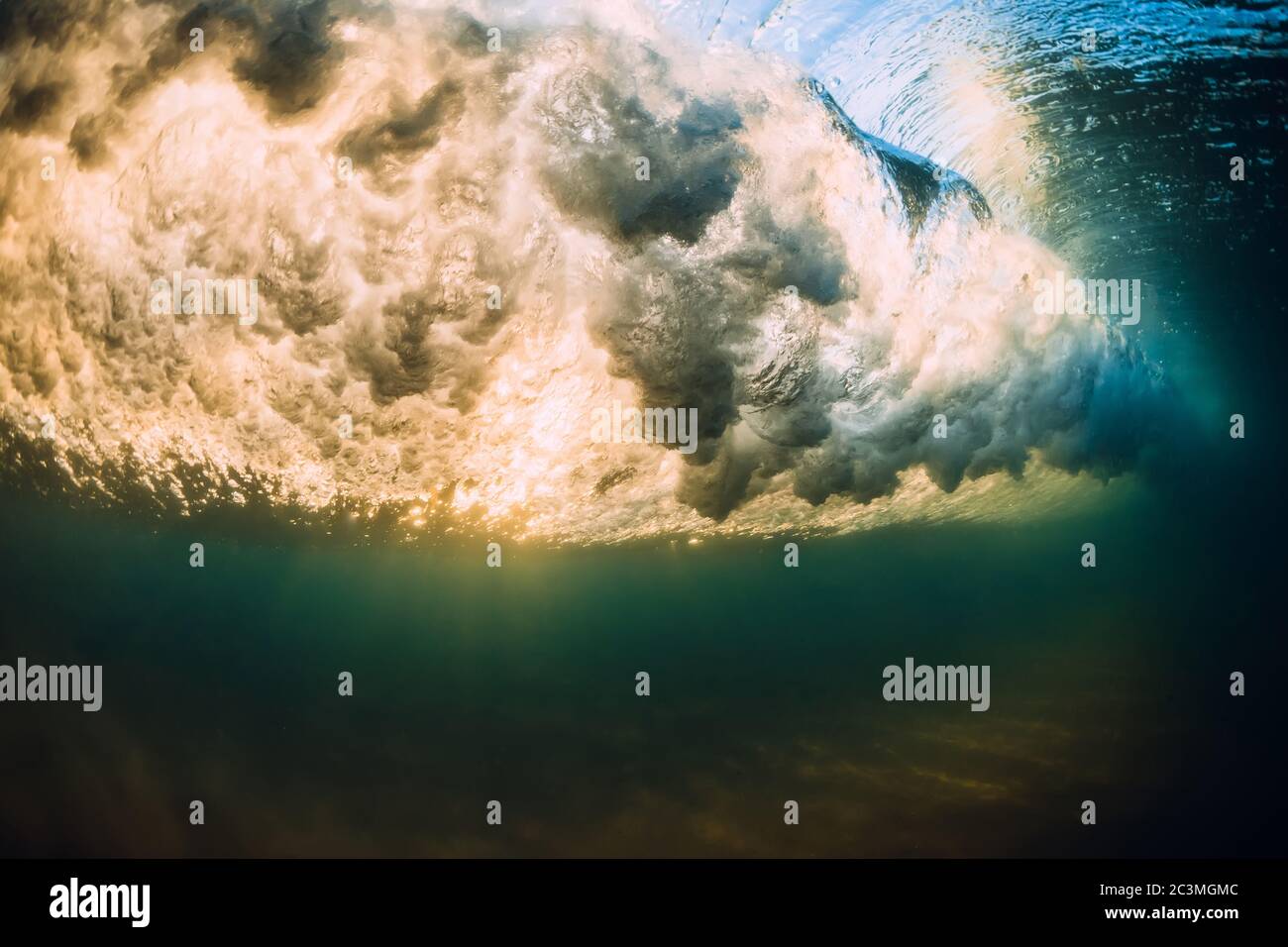 Ocean wave with vortex in underwater. Sea underwater with sunrise or ...