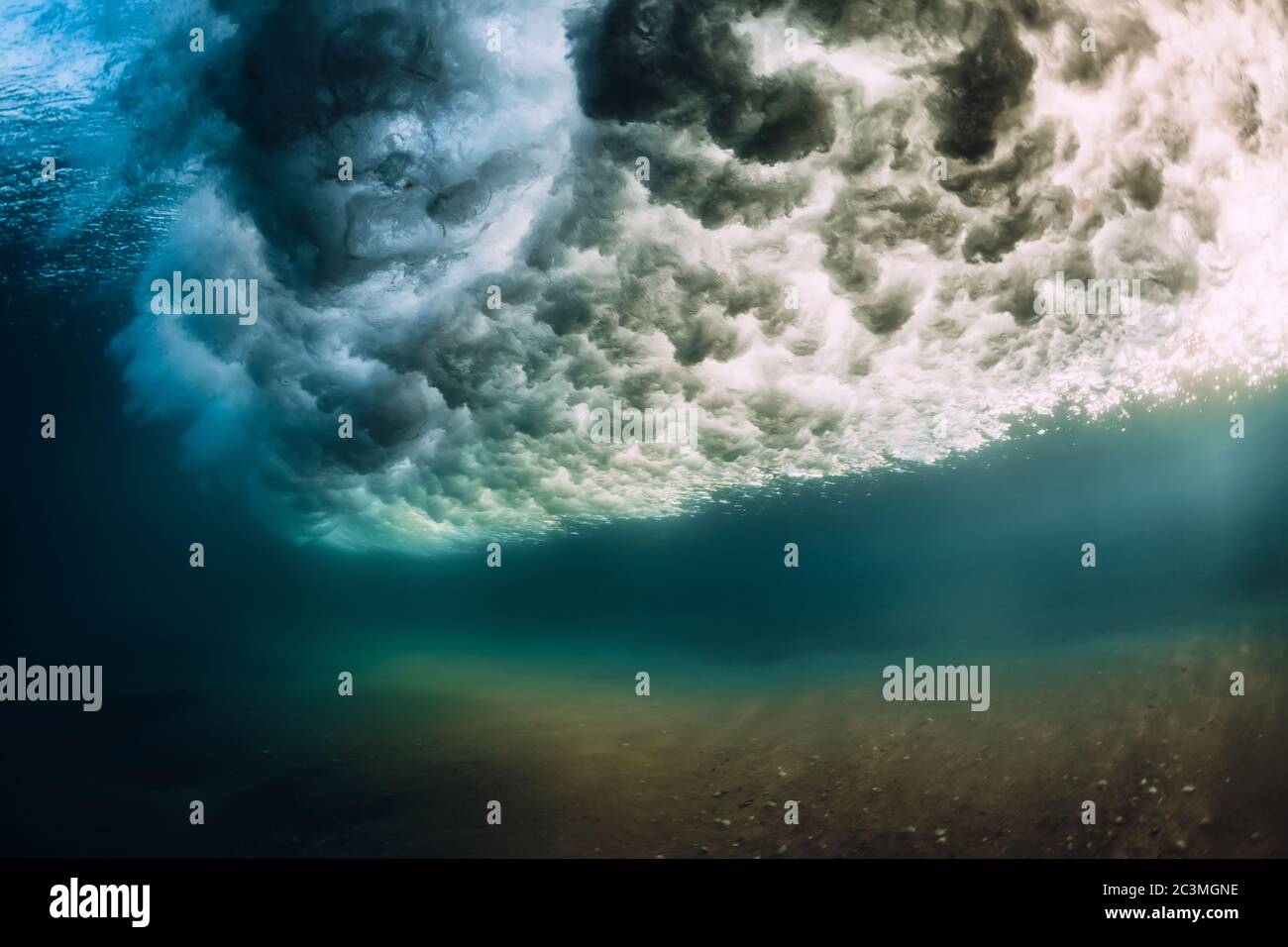 Ocean wave with vortex in underwater. Sea underwater with sunrise or ...