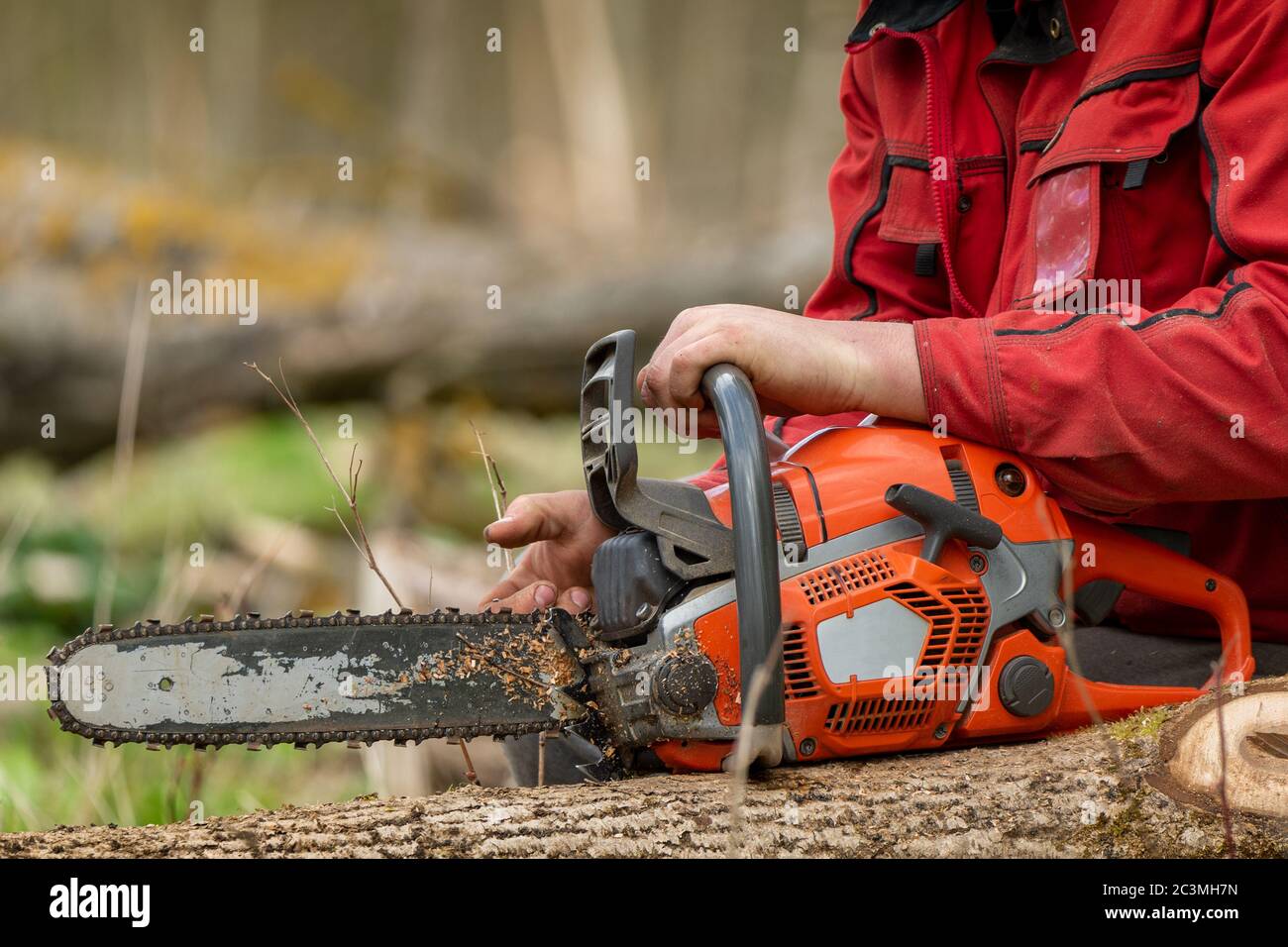 Man works chainsaw in hi-res stock photography and images - Alamy