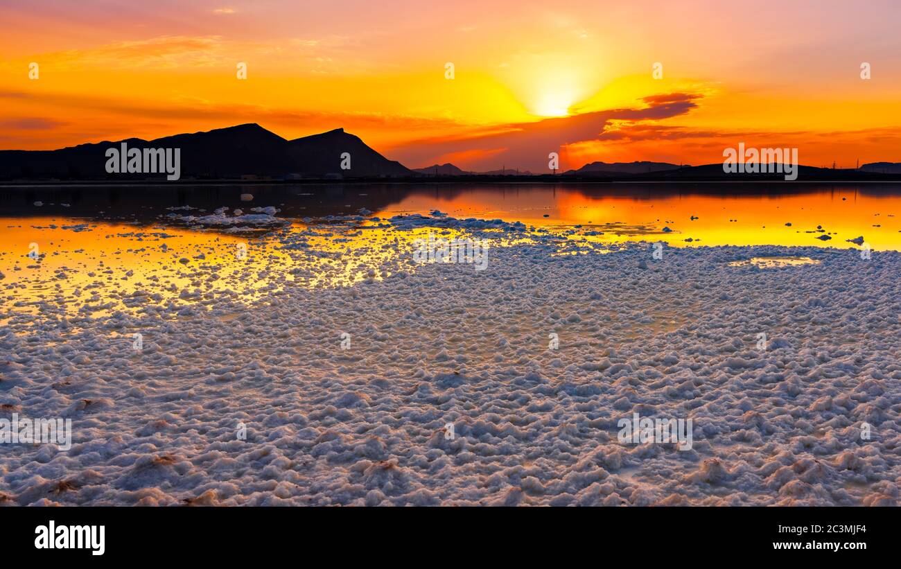 Bright colorful sunset on a salt lake Stock Photo - Alamy