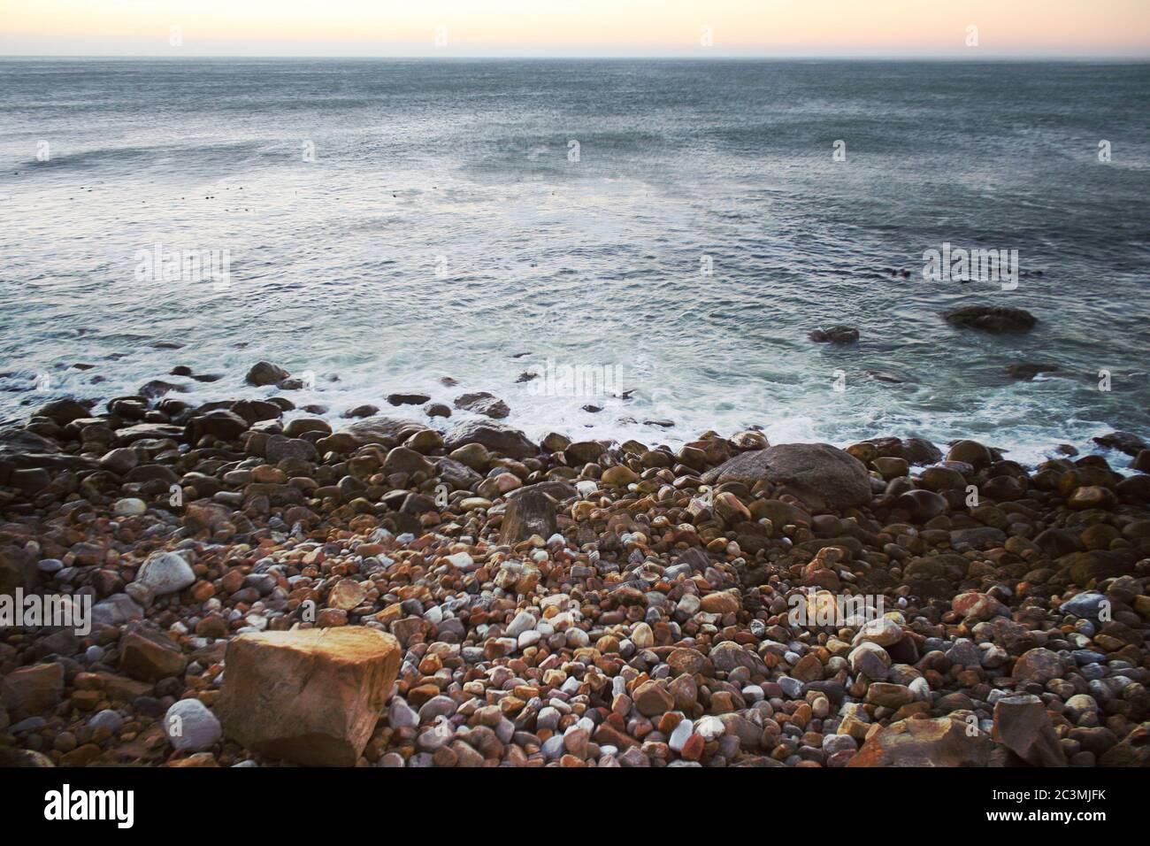 Beautiful view of sea waves hitting rocks on the beach Stock Photo - Alamy