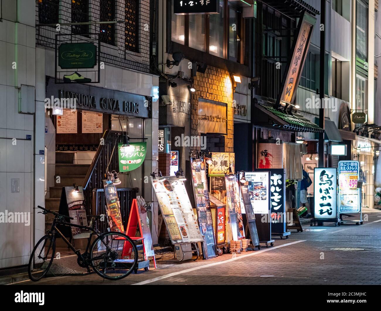 Ginza back alley lane illuminated with lights, Tokyo, Japan Stock Photo ...