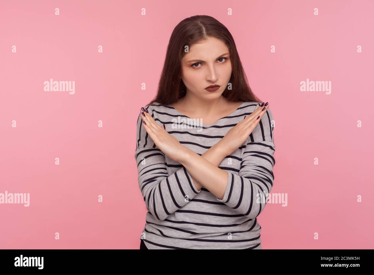 No way, forbidden access! Portrait of angry strict woman in striped ...