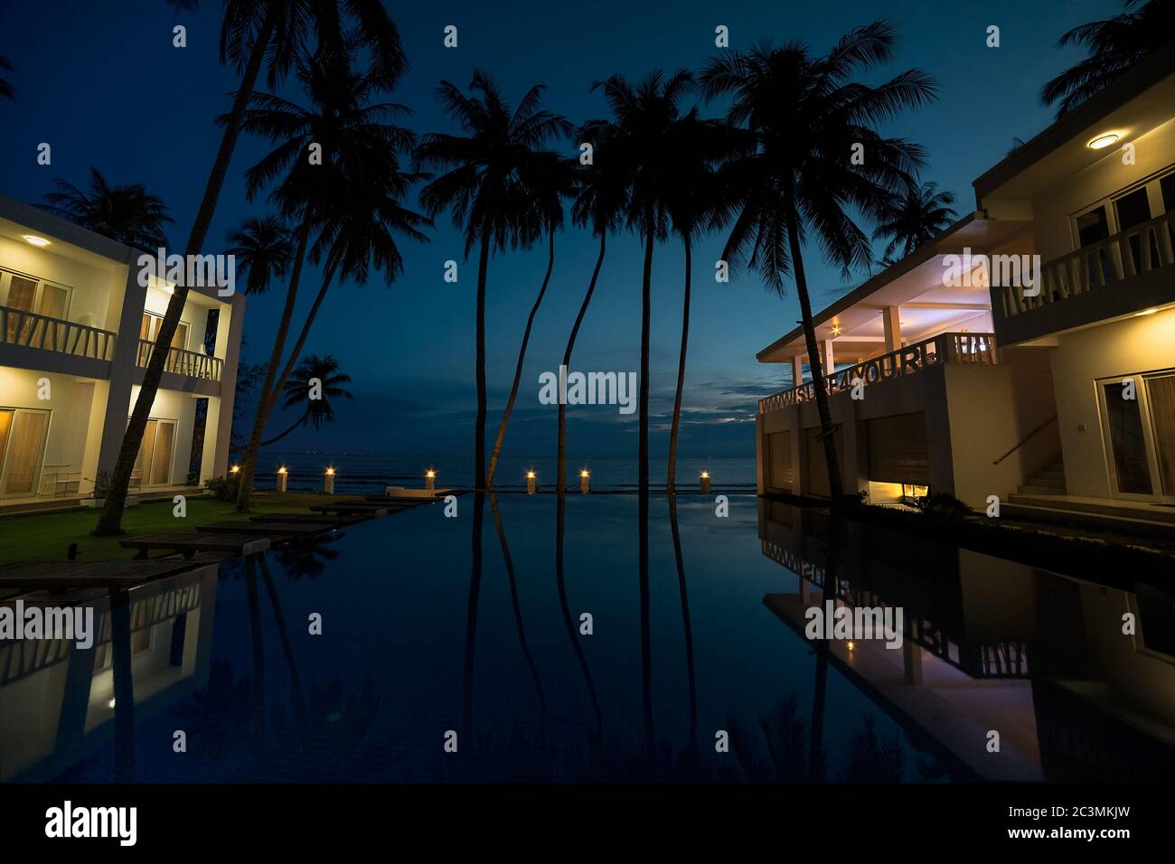 Swimming pool of luxury hotel at night Stock Photo - Alamy